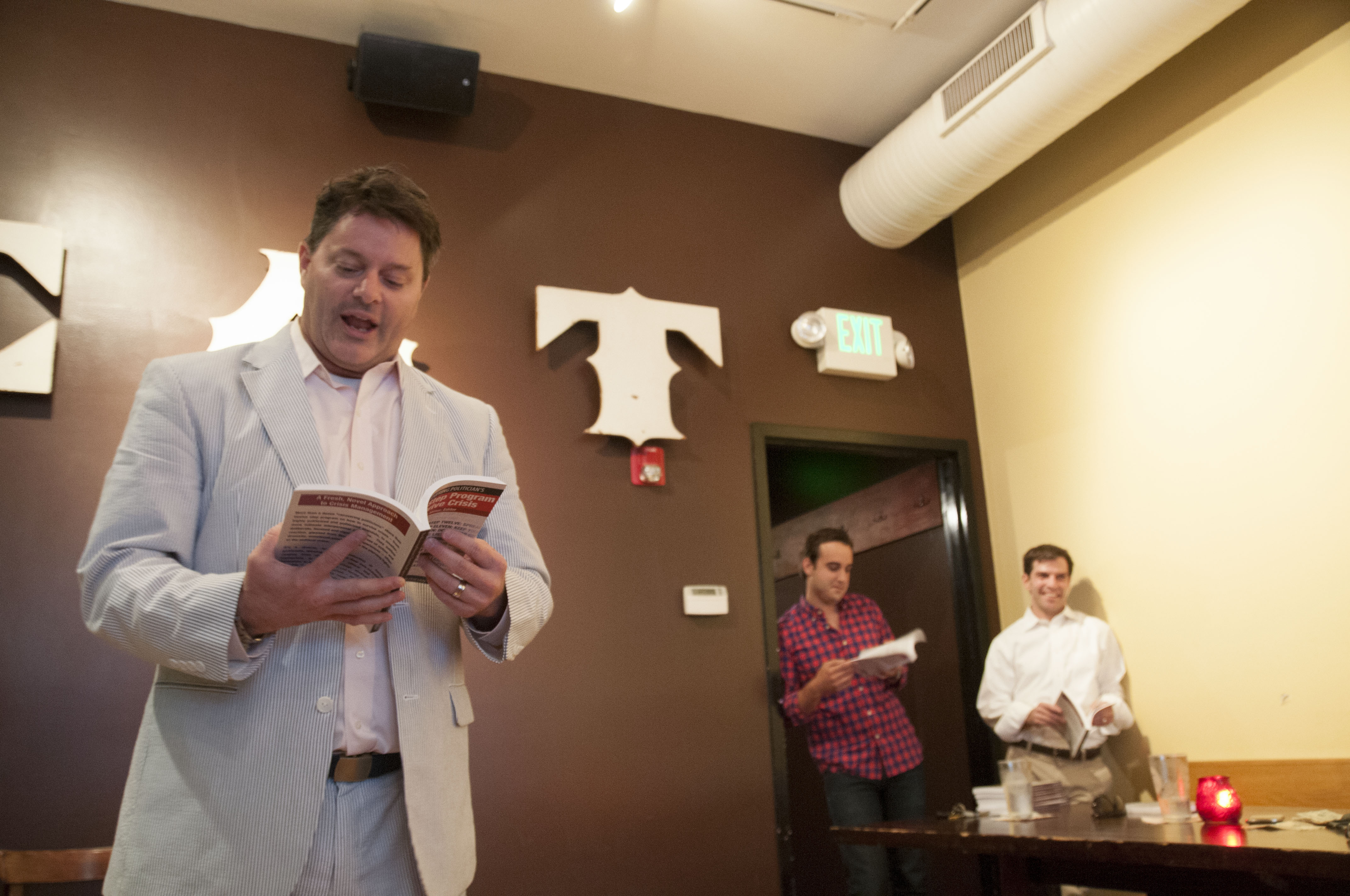 Smith, Jetton, Grill sign copies of their co-authored book about ...